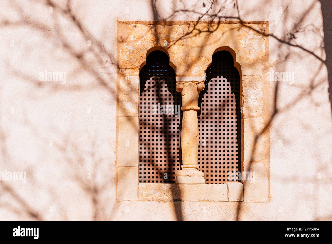 Detail bifora window. San Nicolás de Bari chuch. Torrecaballeros ...