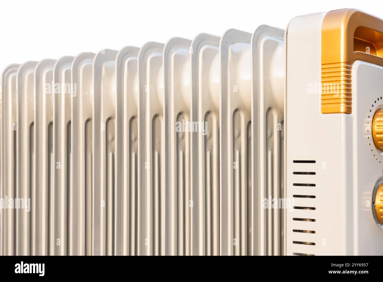 Modern electric oil-filled radiator, convection heater used in domestic ...