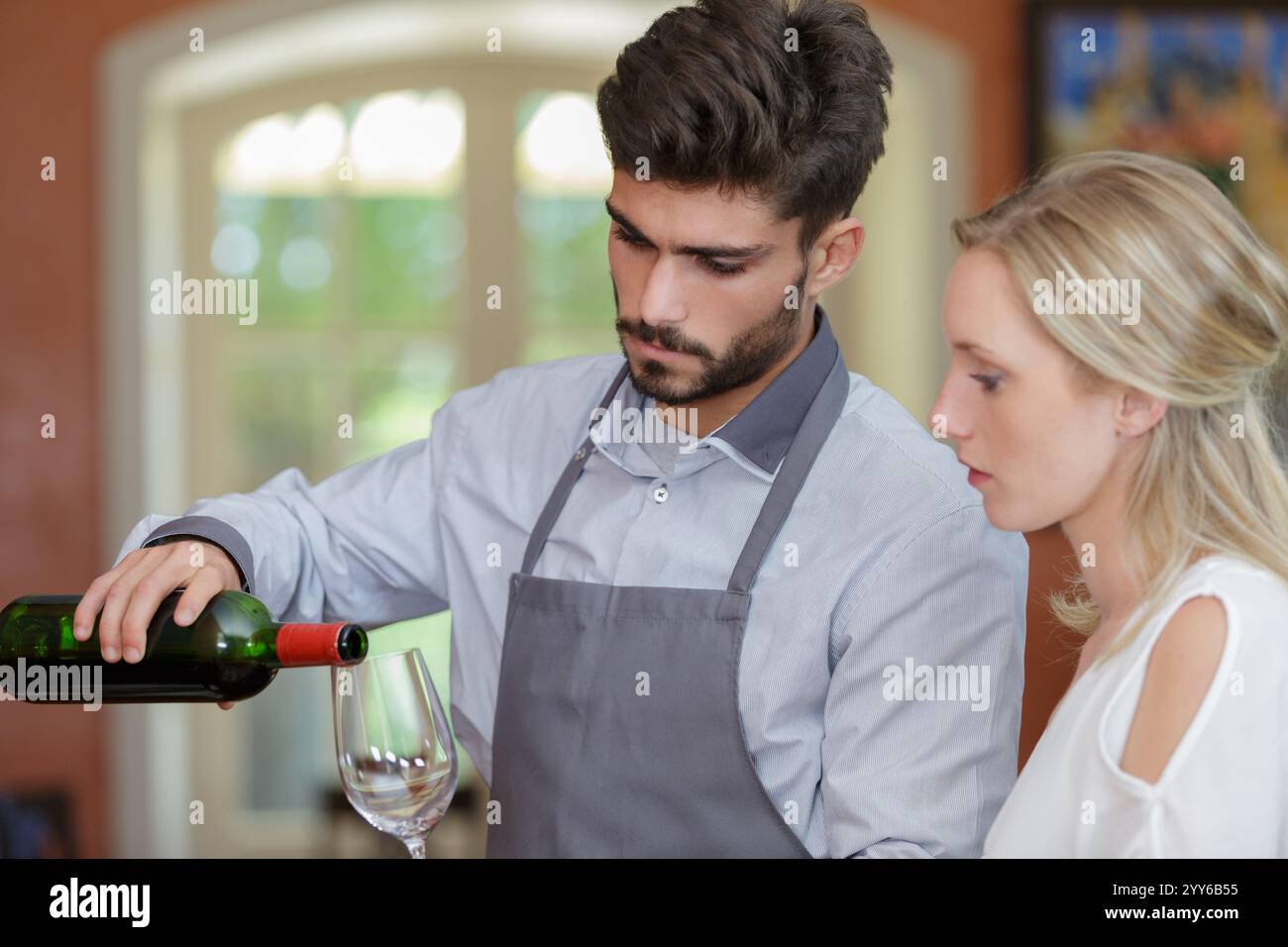 Giving tasting sample hi-res stock photography and images - Alamy