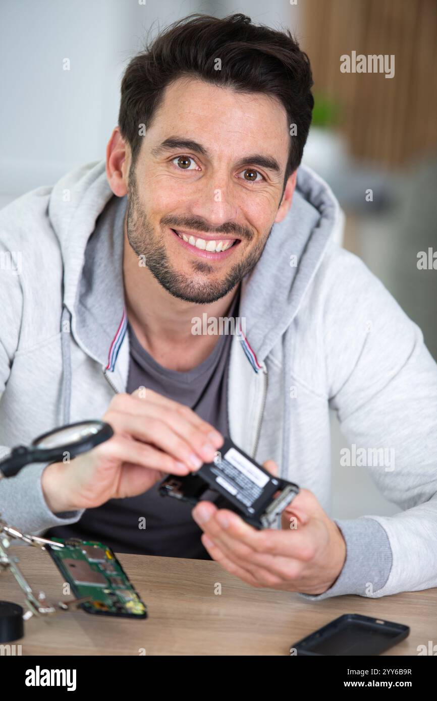electrical engineering smiling at the camera Stock Photo - Alamy