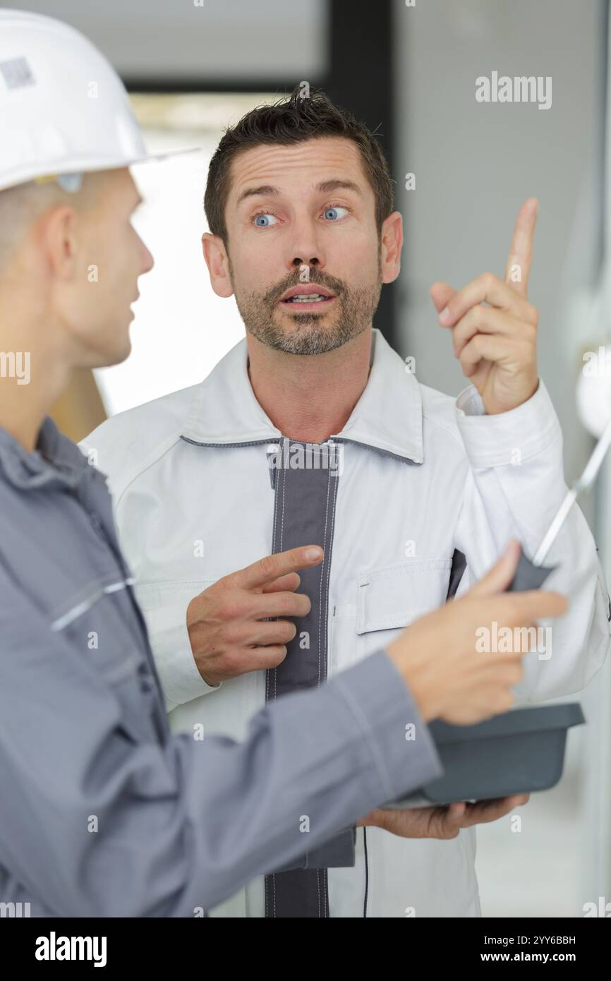 commercial painter instructor giving lesson to apprentice Stock Photo ...