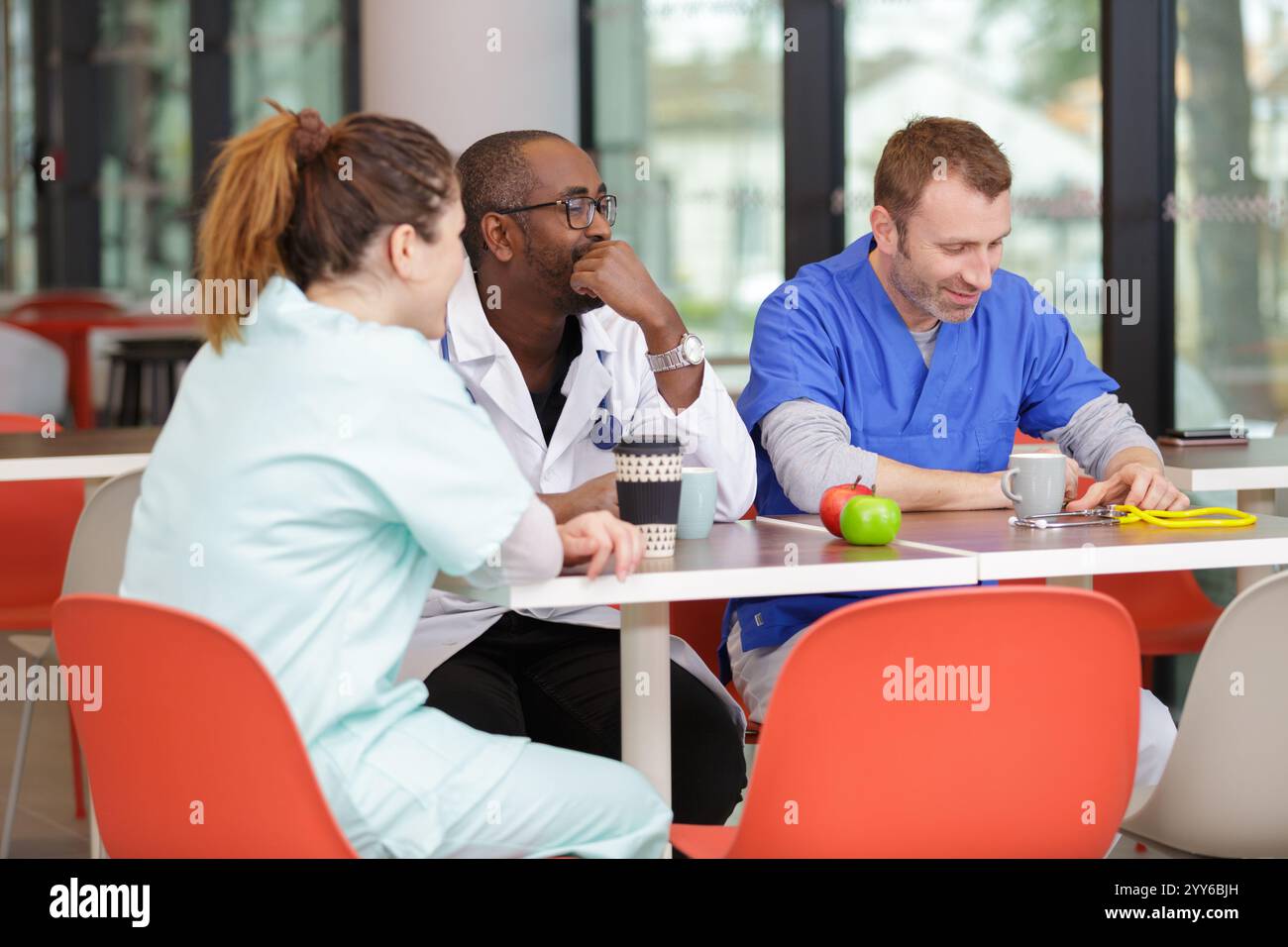 doctors eat as a team in the cafeteria Stock Photo - Alamy