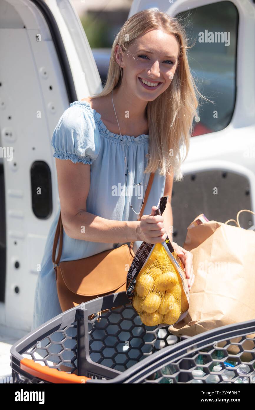Young woman in store lot hi-res stock photography and images - Alamy