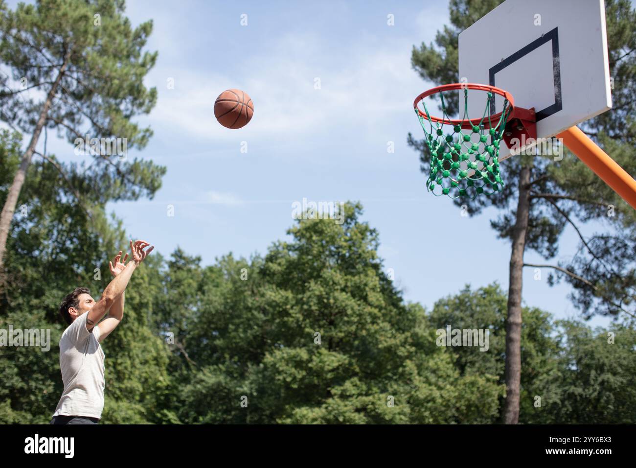basketball player in action scoring Stock Photo - Alamy