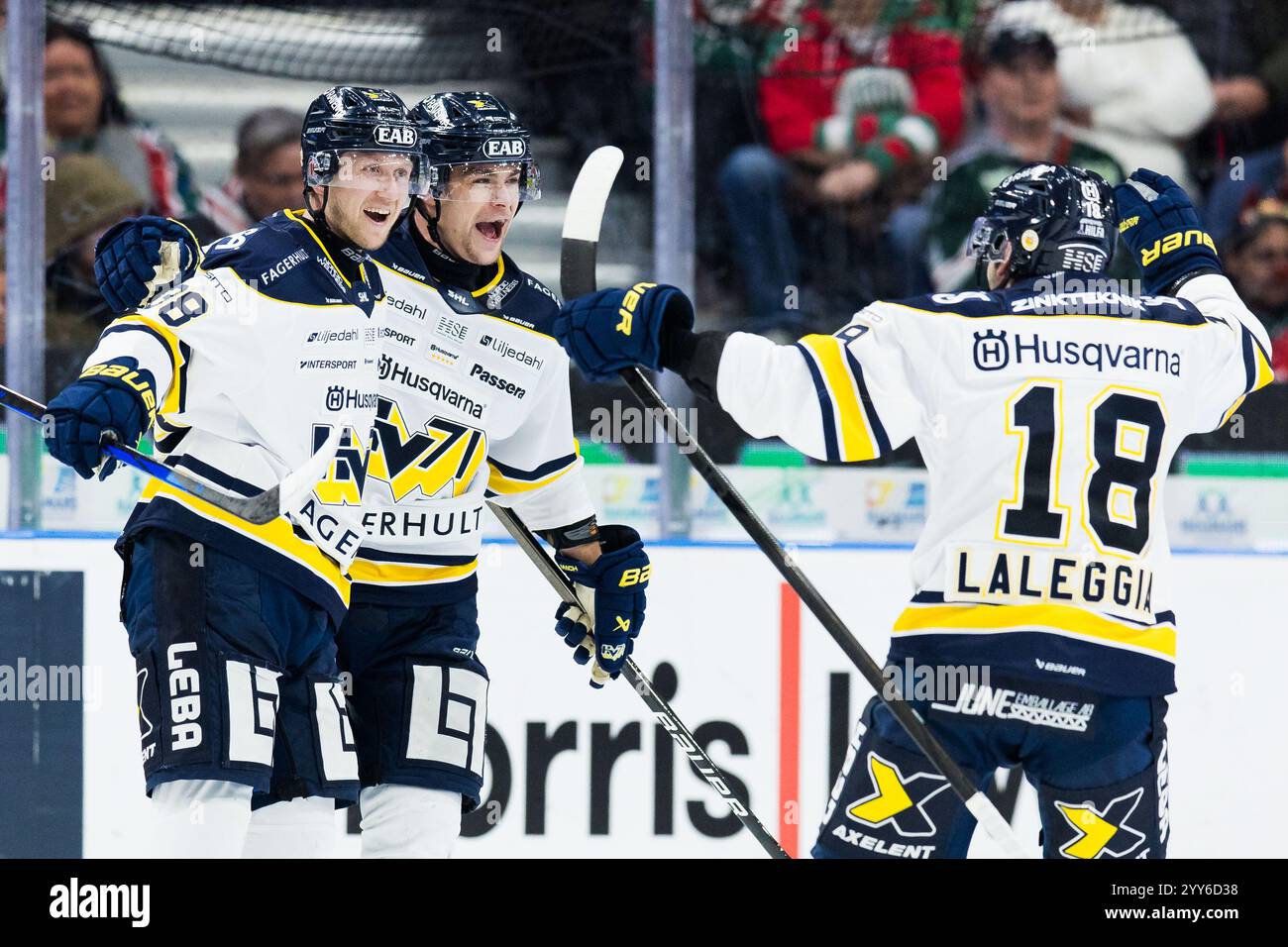 241219 HV71s Olle Alsing jublar med Radan Lenc och Joseph Laleggia efter 1-4 under ...