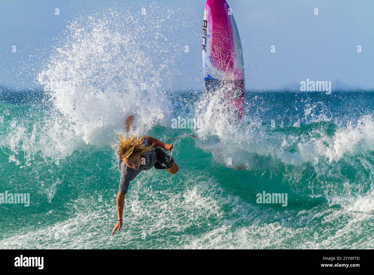 Surfer coming off surfboard, Wipeout Stock Photo - Alamy