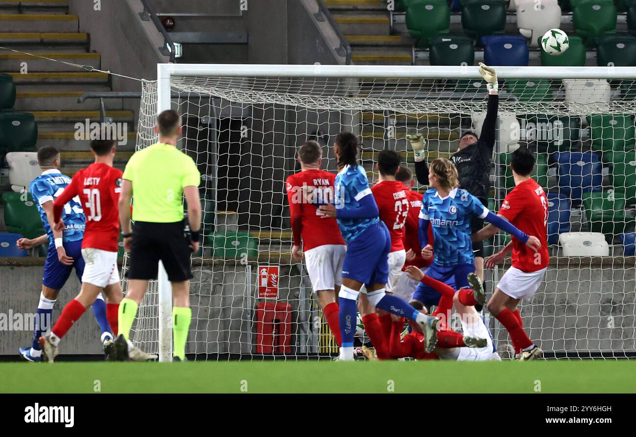 Larne goalkeeper Rohan Ferguson makes a save from a Gent corner during ...