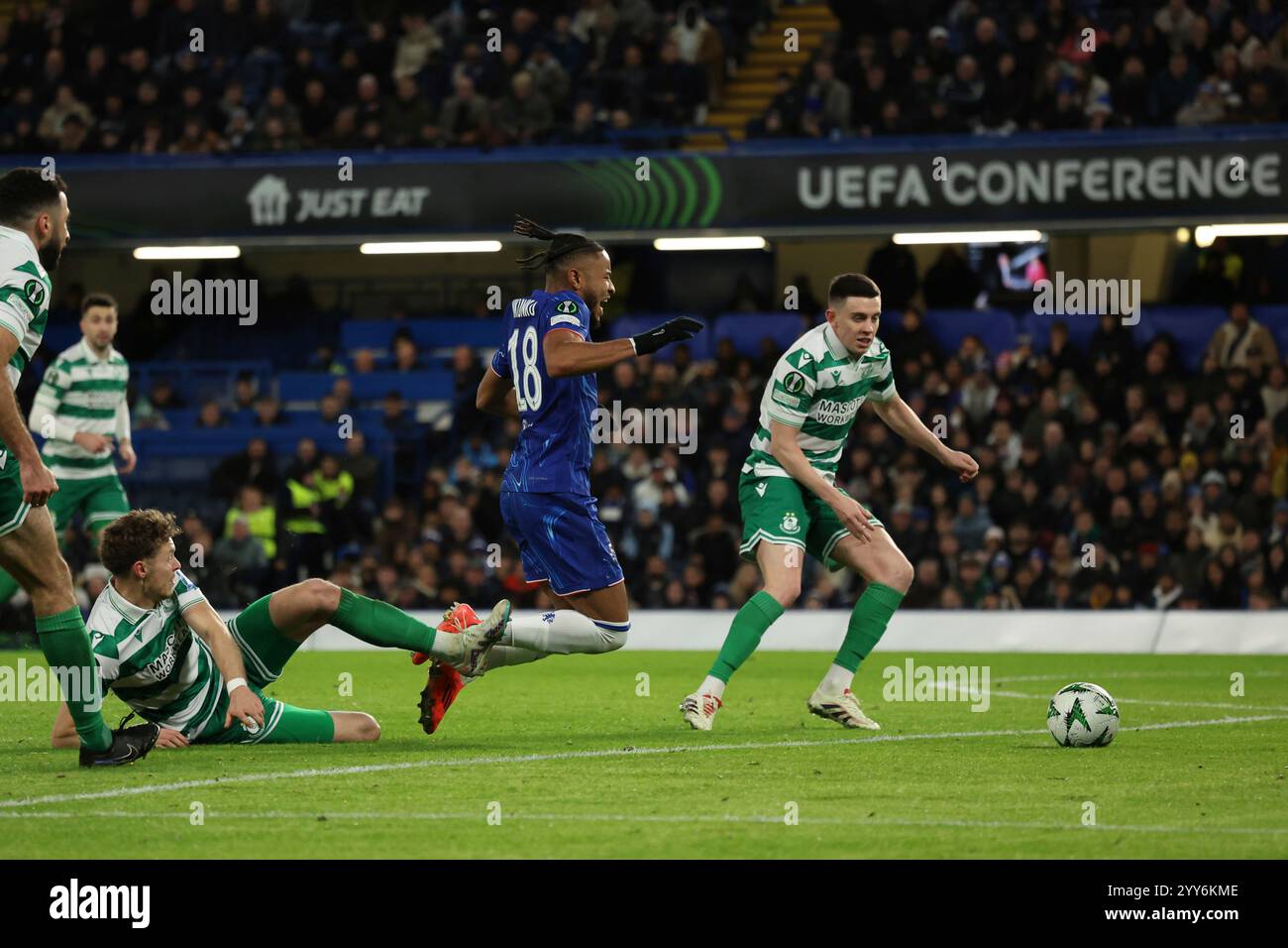 Chelsea's Christopher Nkunku, center, is fouled by Shamrock Rovers's ...
