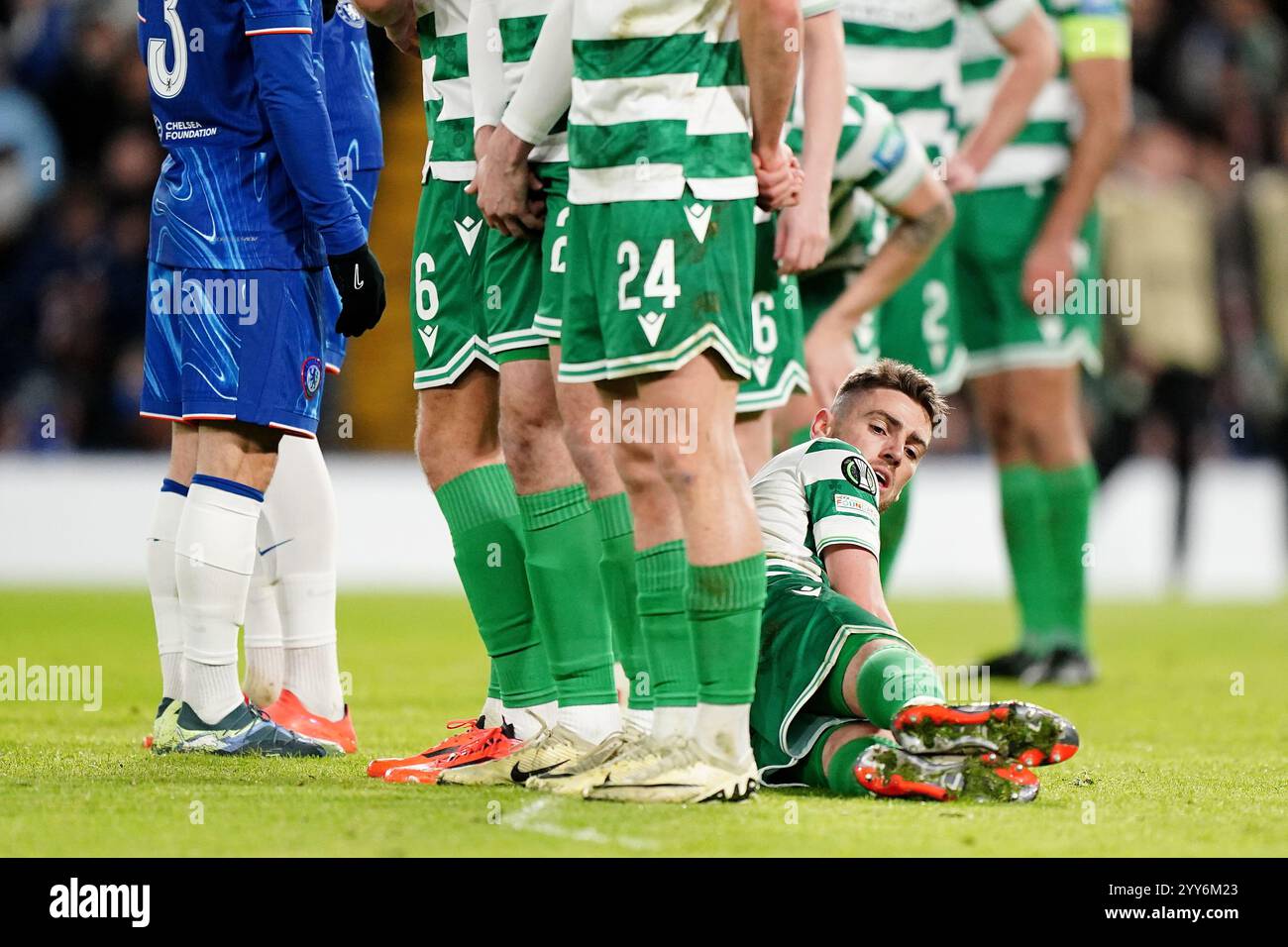 Shamrock Rovers' Dylan Watts lays behind a defensive wall during the ...
