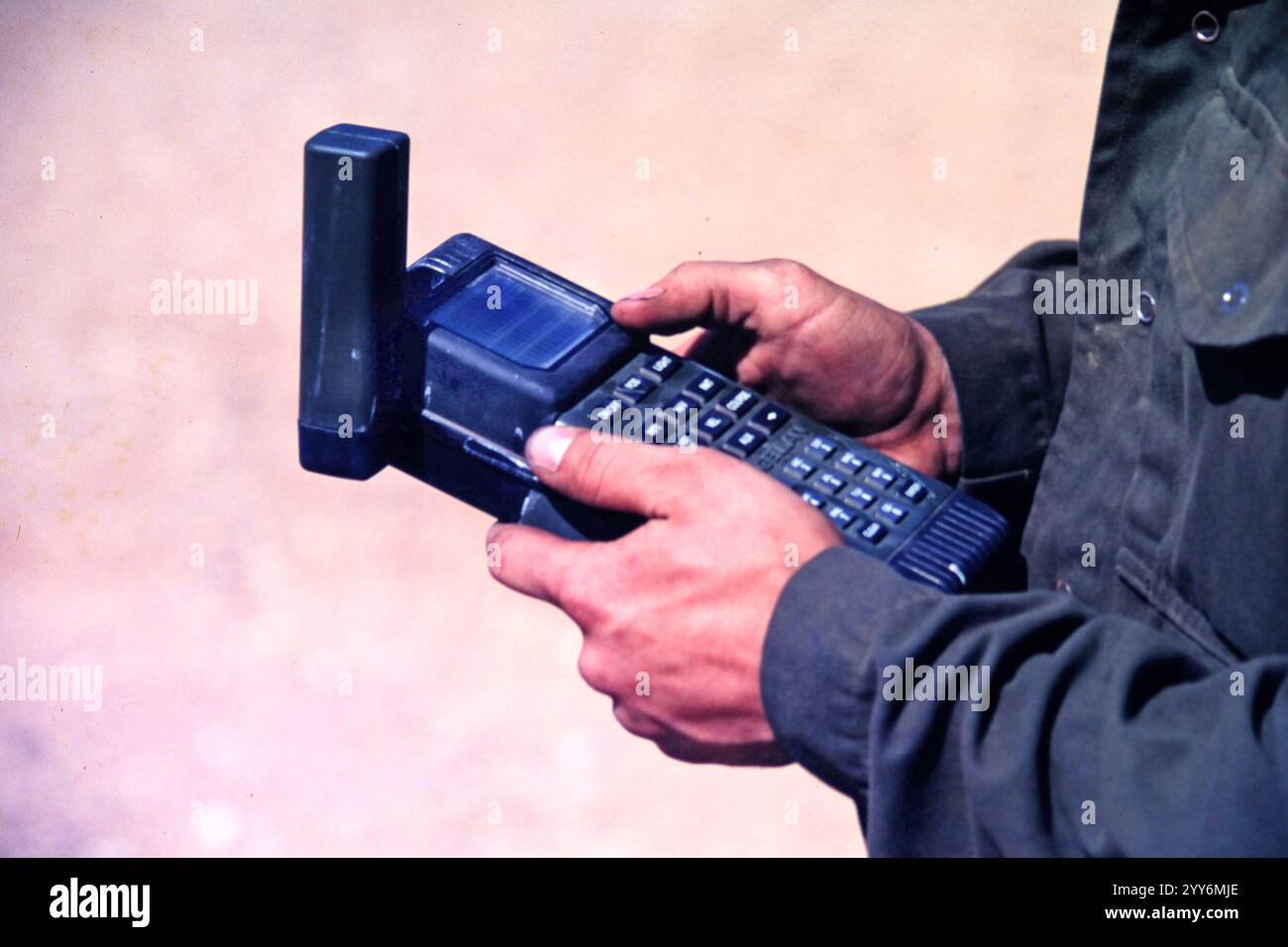A member of the Air Force uses a GPS tool 1991 Photograph by Dennis ...