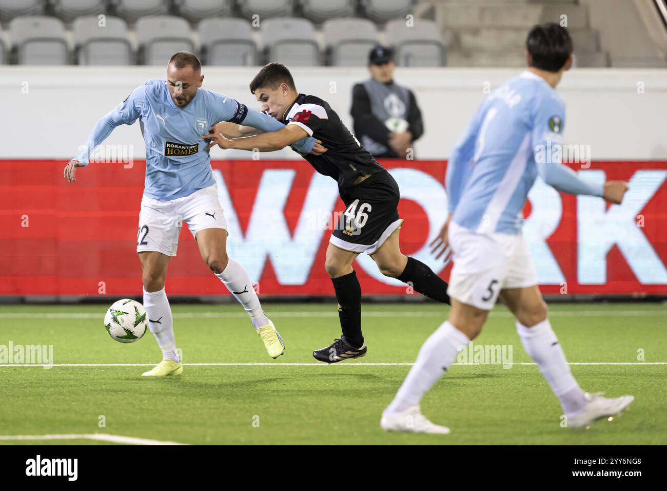 Pafos's Muamer Tankovic, left, and Lugano's Mattia Zanotti in action ...