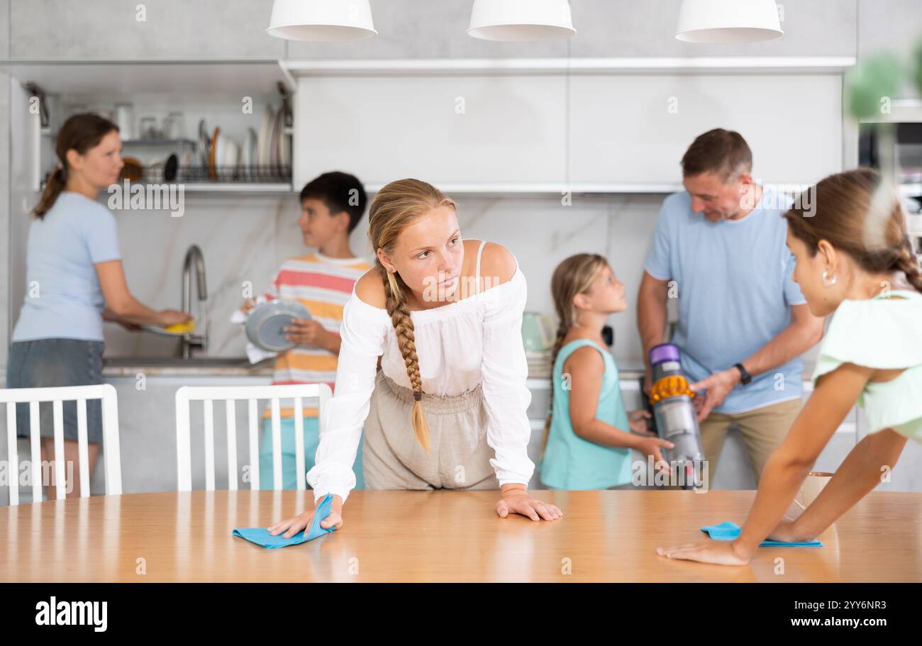 Big family members cleaning their house Stock Photo - Alamy