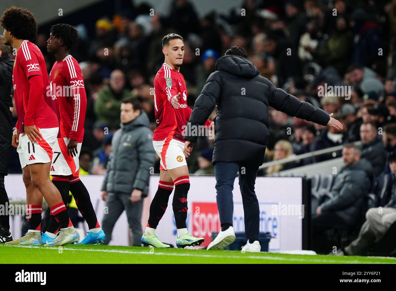 Manchester United's Antony is embraced by manager Ruben Amorim (right ...