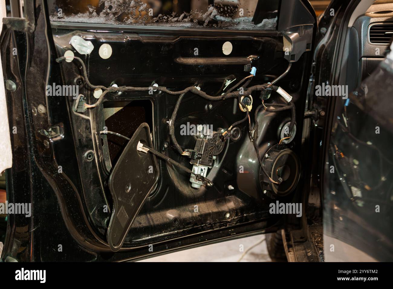 Detailed View of Car Door Assembly with Exposed Mechanisms and Wiring ...