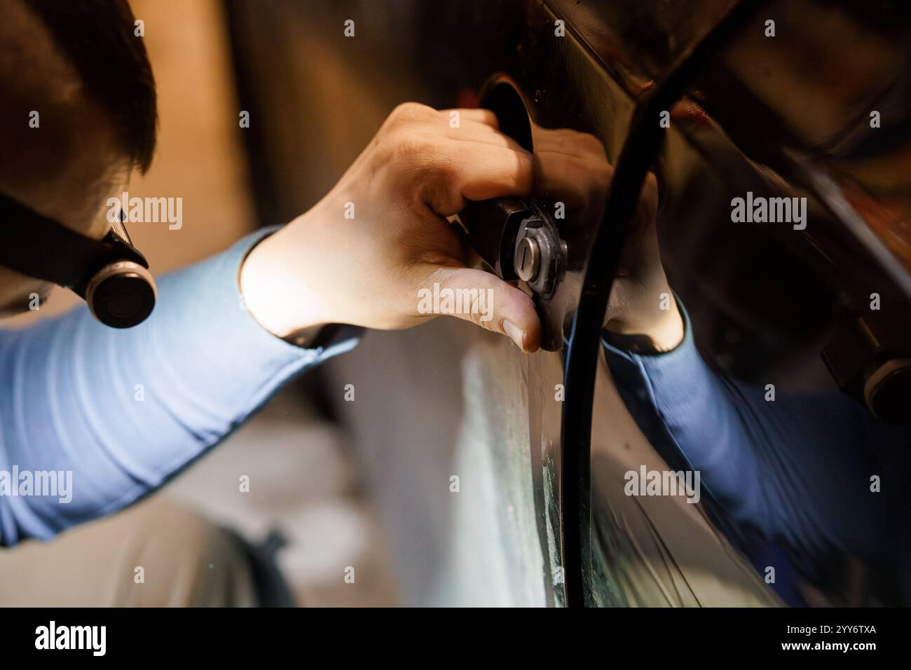 Skilled Mechanic Performing Detailed Car Repair with Precision Tools ...