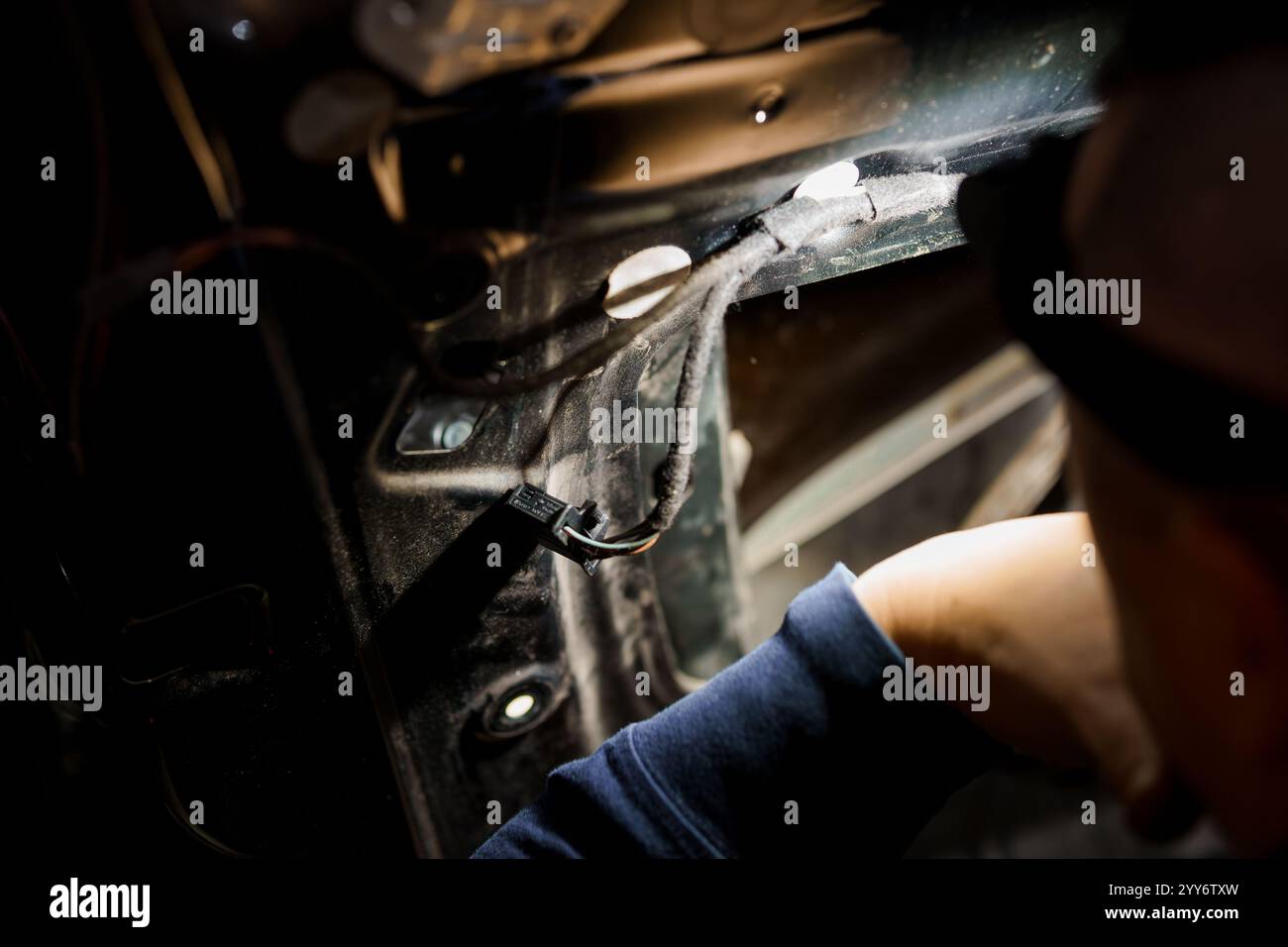 Interior Mechanic Inspection of a Vehicle's Wiring with Focused ...