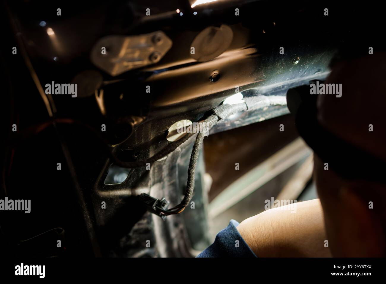 Mechanics working underneath car hi-res stock photography and images ...