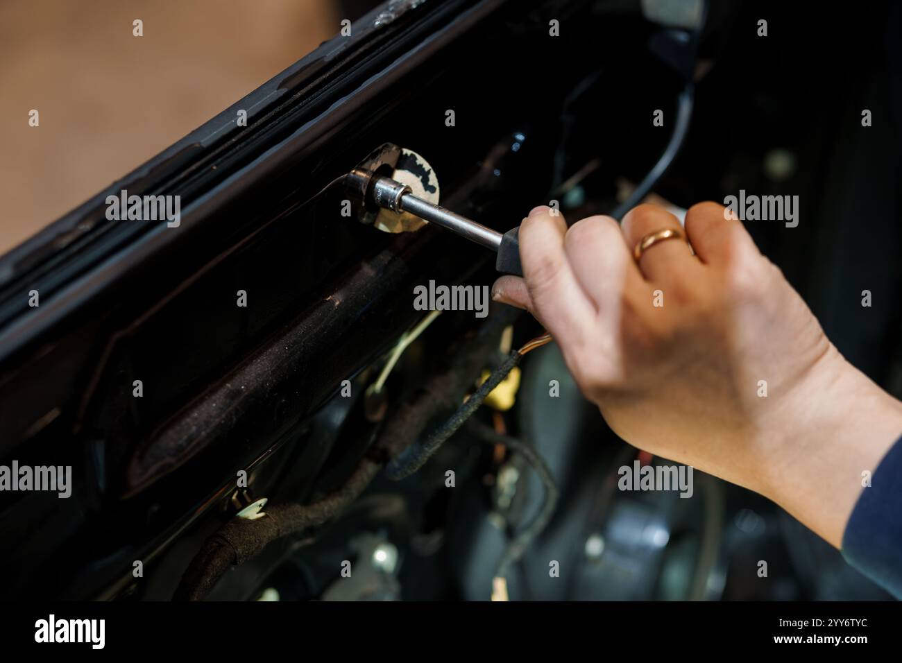 Car Mechanic Working on Engine Component with Socket Wrench Stock Photo ...