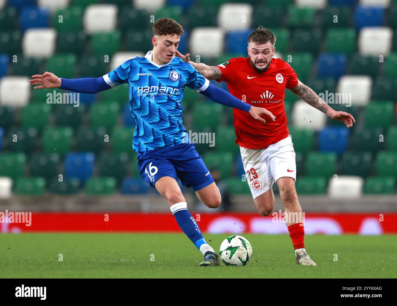 Gent's Mathias Delorge (left) and Larne's Andrew Ryan battle for the ...