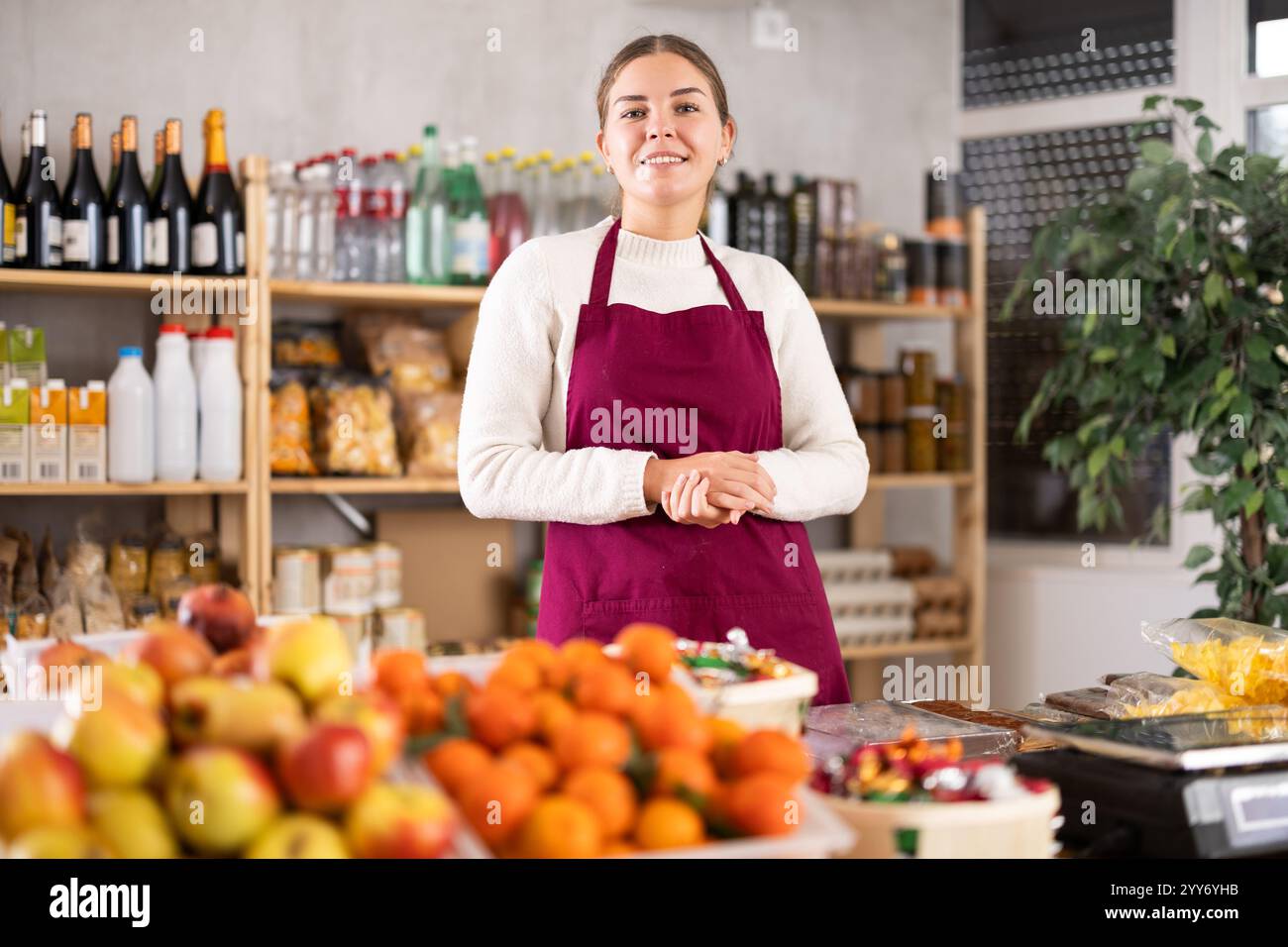 Woman salesperson behind counter hi-res stock photography and images ...