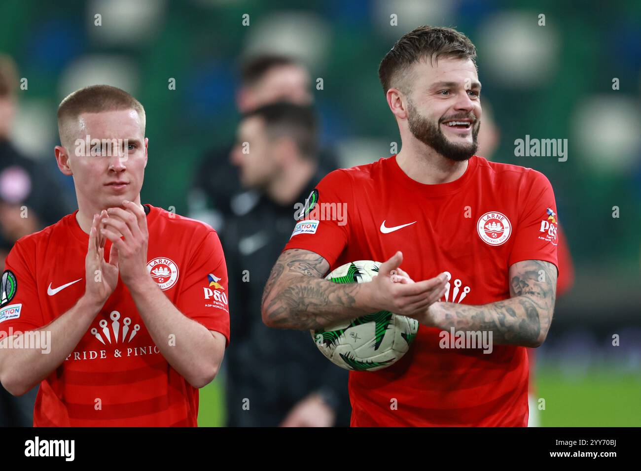 Larne's Andrew Ryan (right) and team-mates applaud the fans after the ...