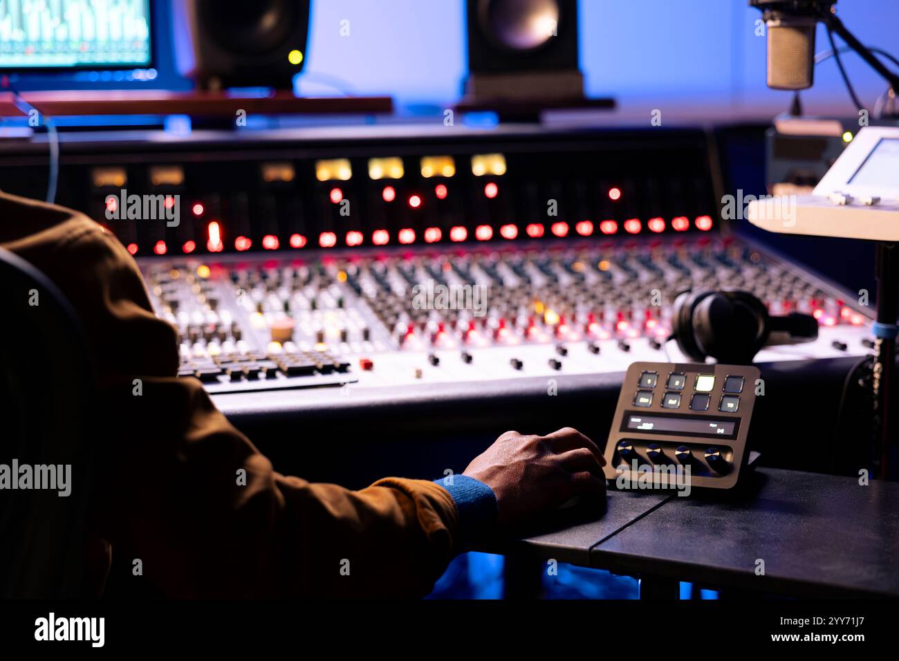 African american expert working at mixing panel in recording studio ...