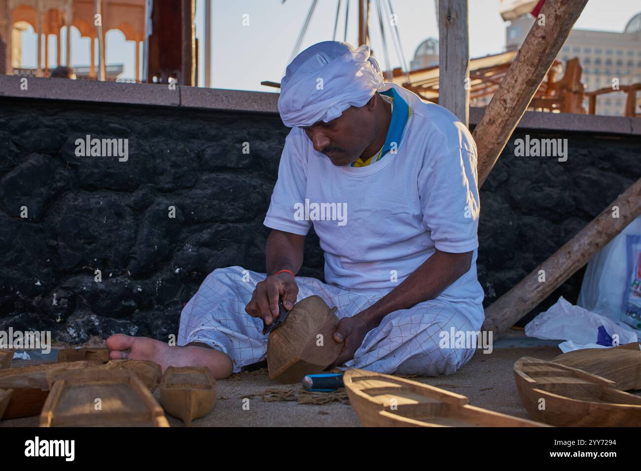 Traditional Arabic carpenter (dhow maker) working in Katara cultural ...