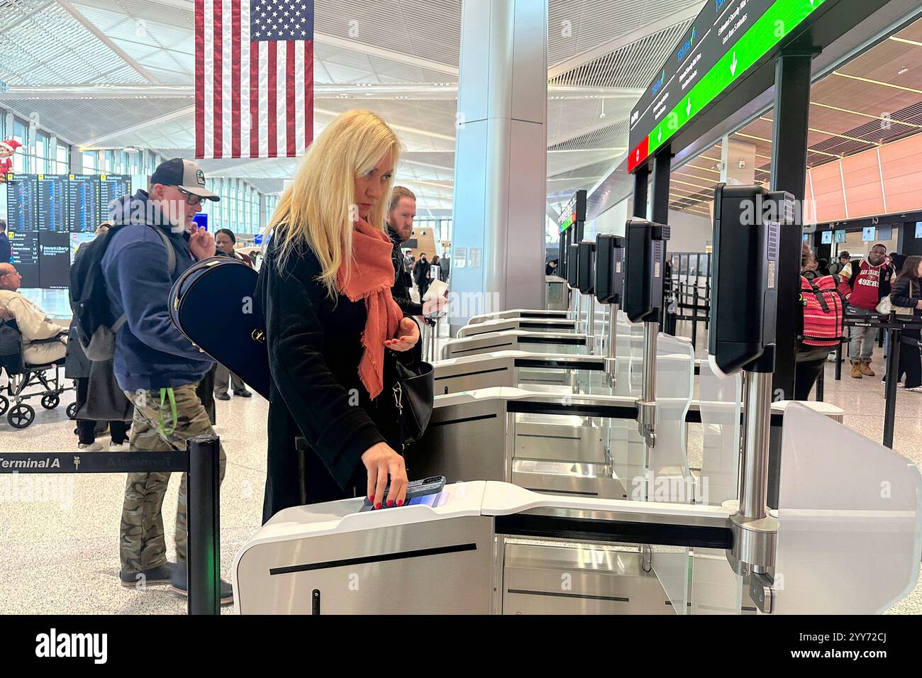 Departing air travelers enter the TSA PreCheck screening lane at Newark ...
