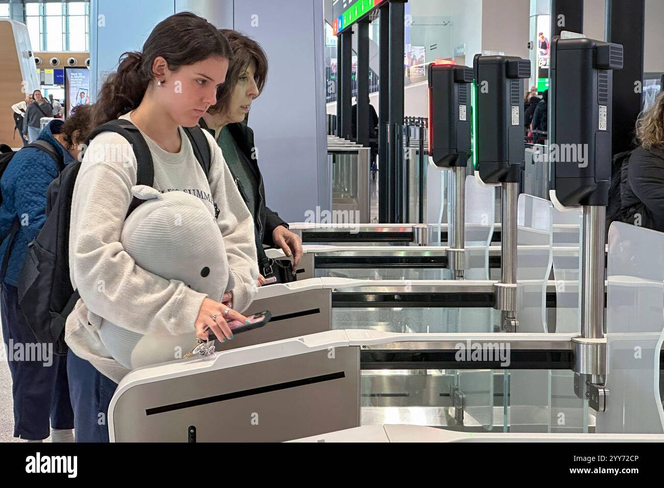 Departing air travelers enter the TSA PreCheck screening lane at Newark ...