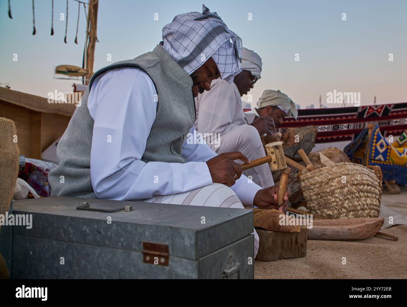 Traditional Arabic carpenters (dhow makers) working in Katara cultural ...