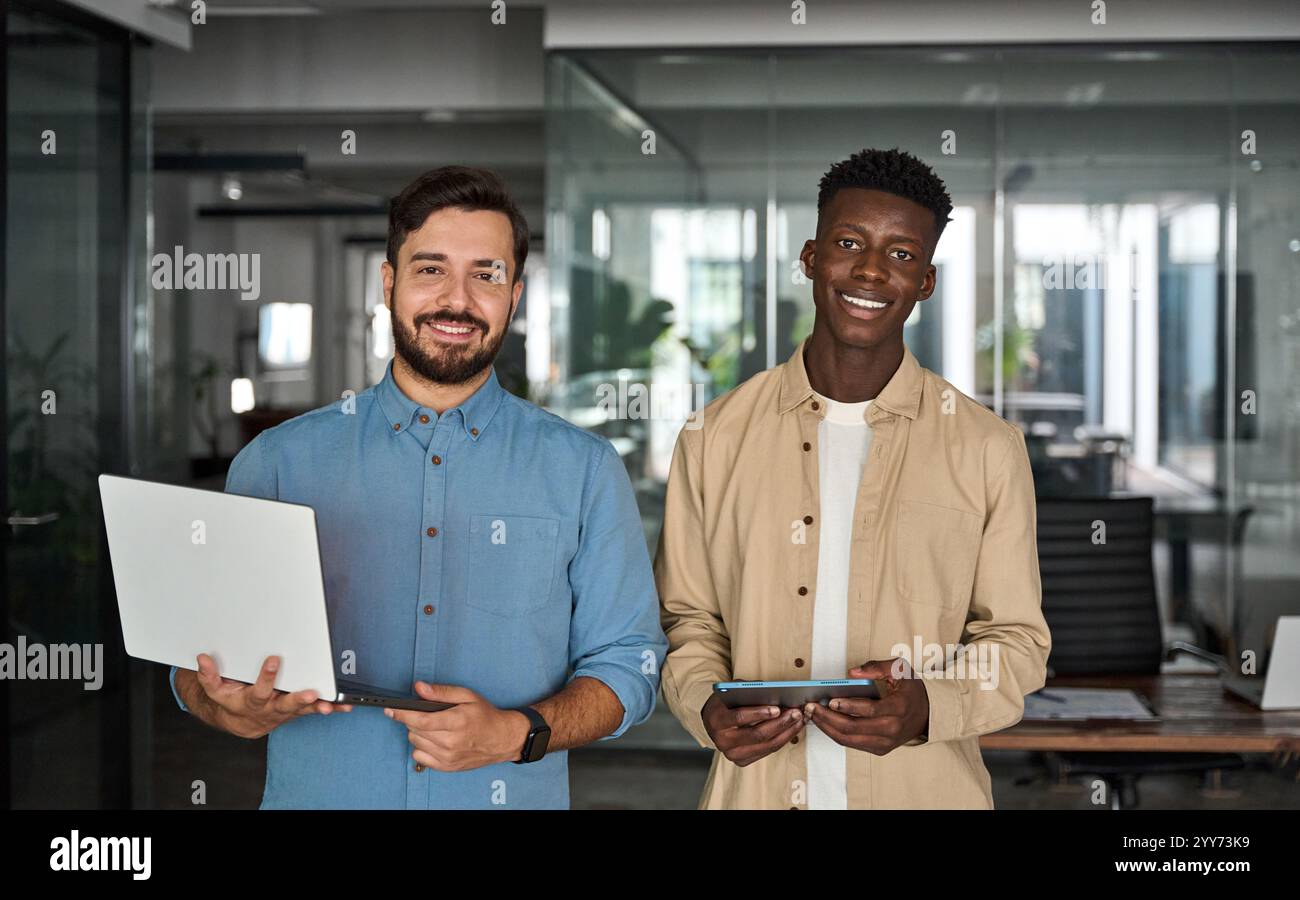 Two businessmen diverse professional executive team standing in office ...