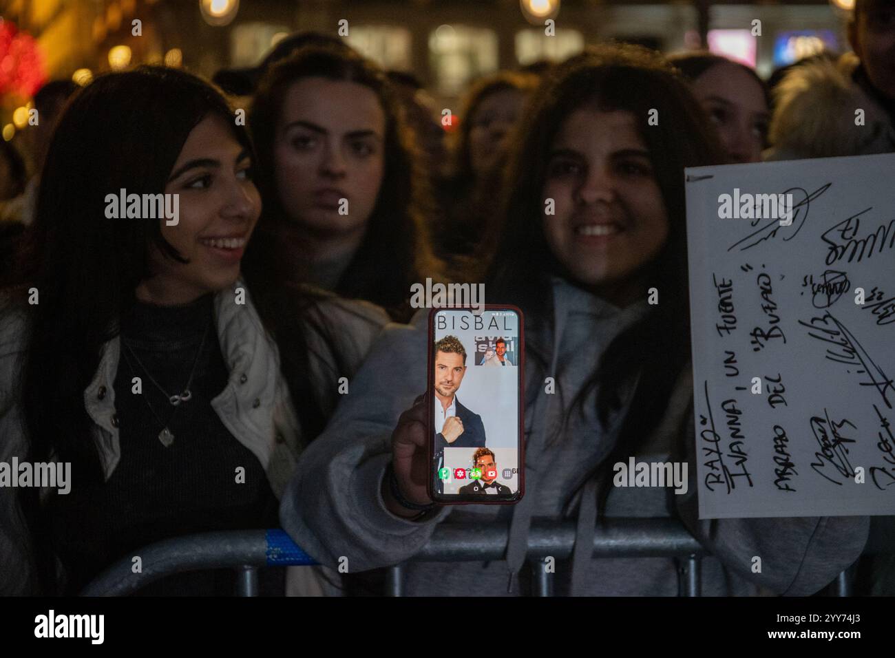 Madrid, Spain. 19th Dec, 2024. A group of fans of David Bisbal show a ...