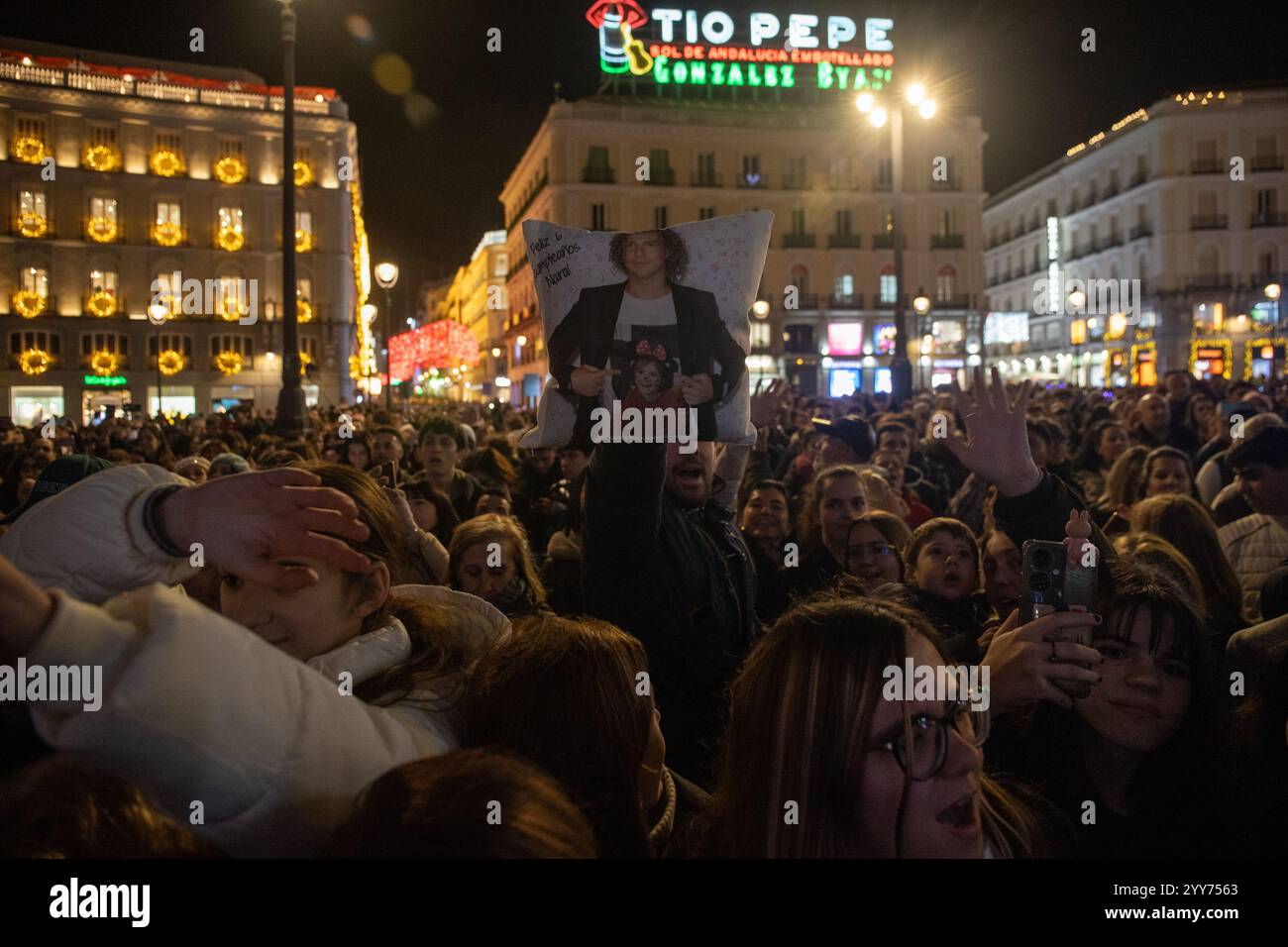 A group of fans of David Bisbal show a cushion with a photograph of the ...