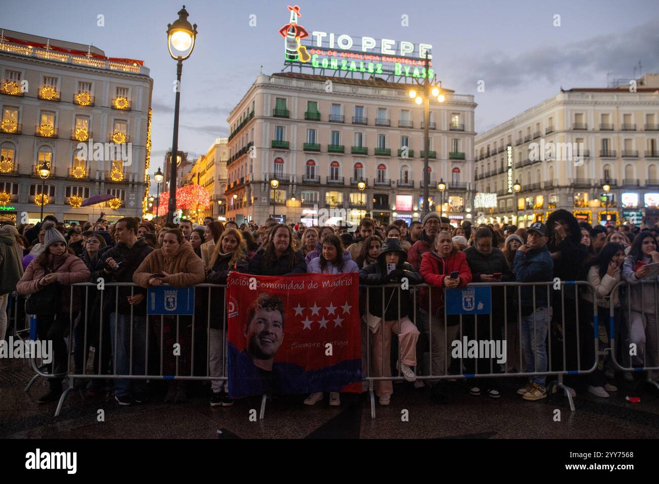 Madrid, Spain. 19th Dec, 2024. Fans await the appearance on the balcony ...