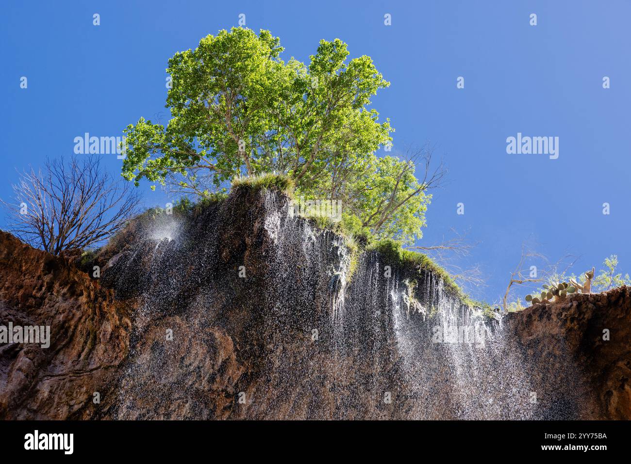 The view looking up as water cascades off of the travertine natural ...