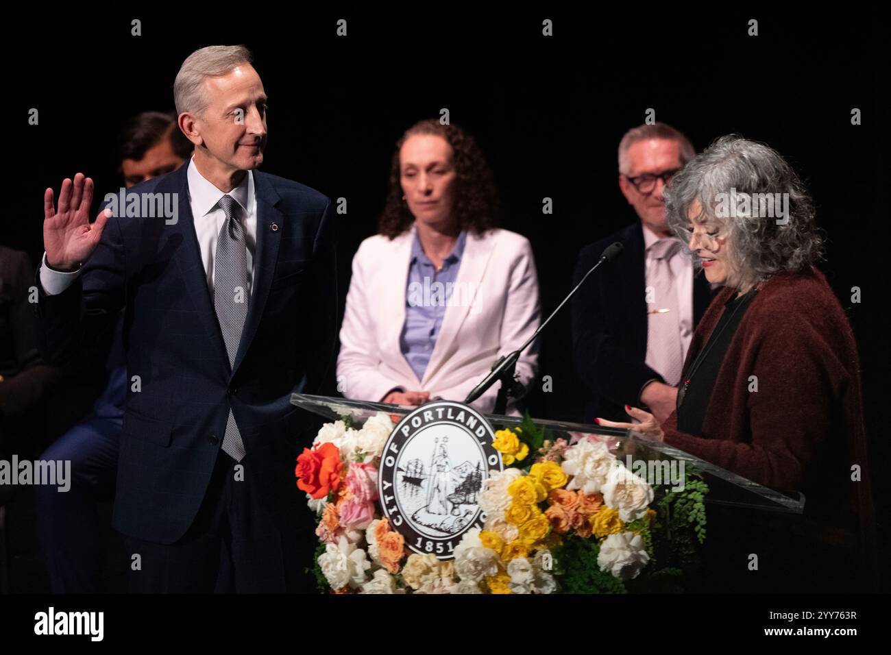 Portland Mayor-elect Keith Wilson, left, is sworn in during a ceremony ...