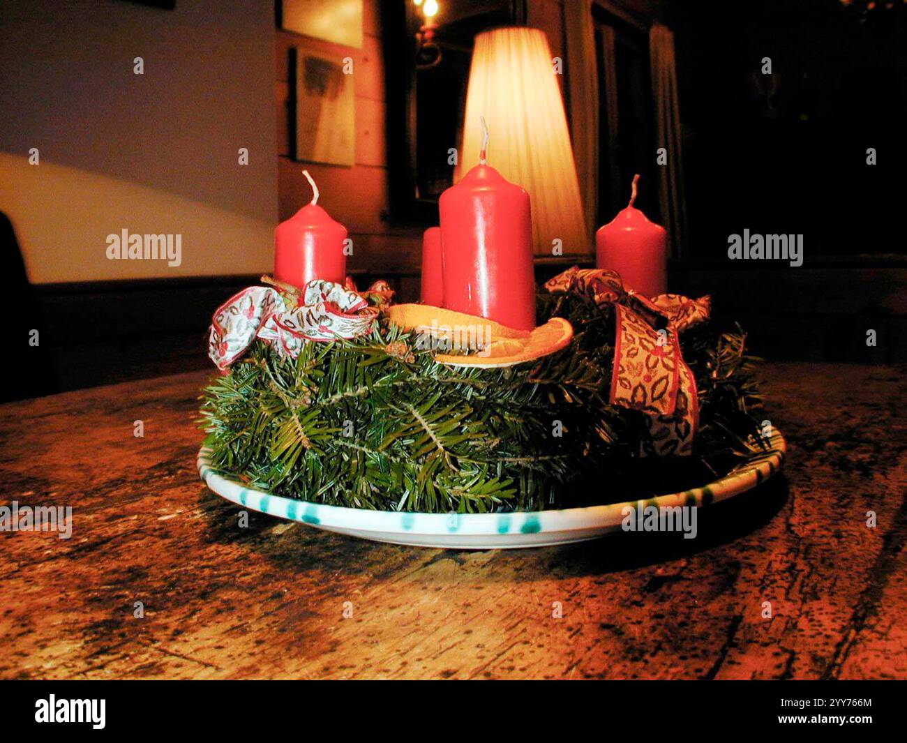 green advent wreath with candles and decorations in christmas season ...