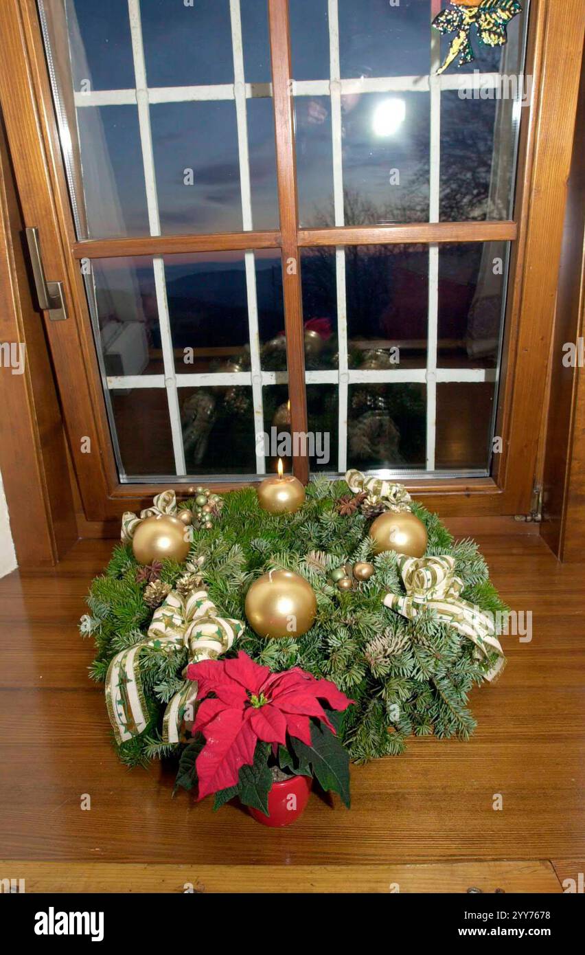 green advent wreath with candles and decorations in christmas season ...