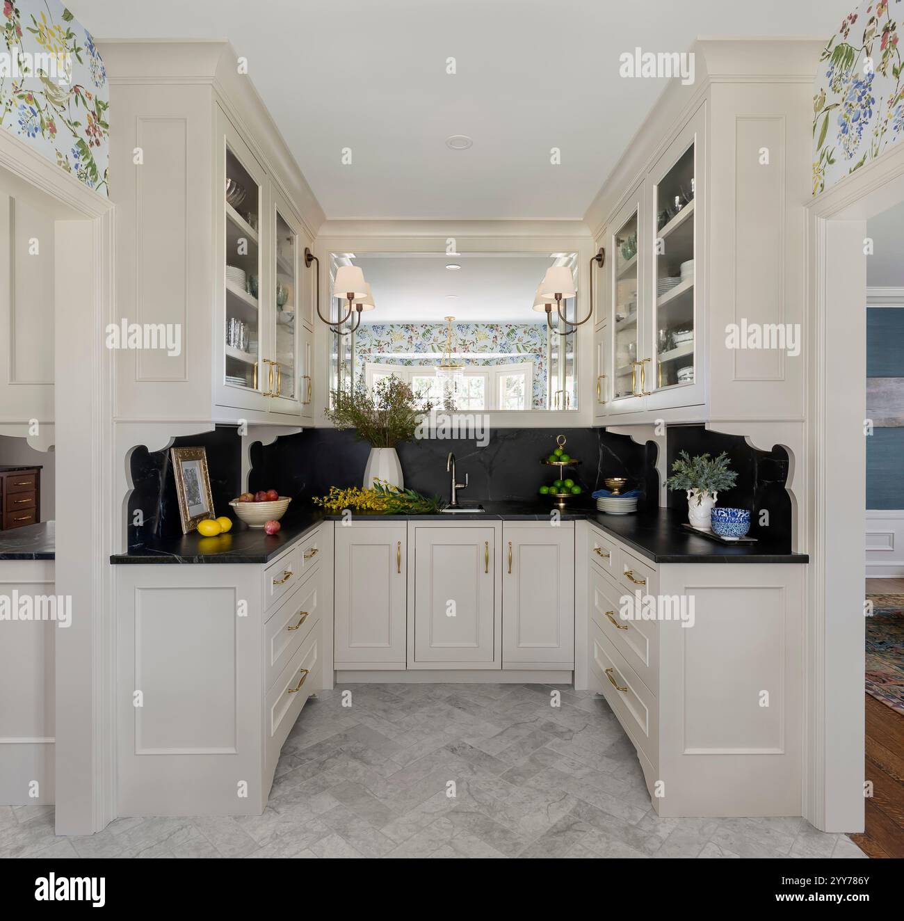 Pantry in high end traditional kitchen with mirror integrated between ...