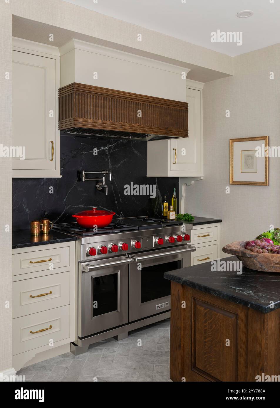 Wolf range in traditional kitchen with custom dark stained white oak ...