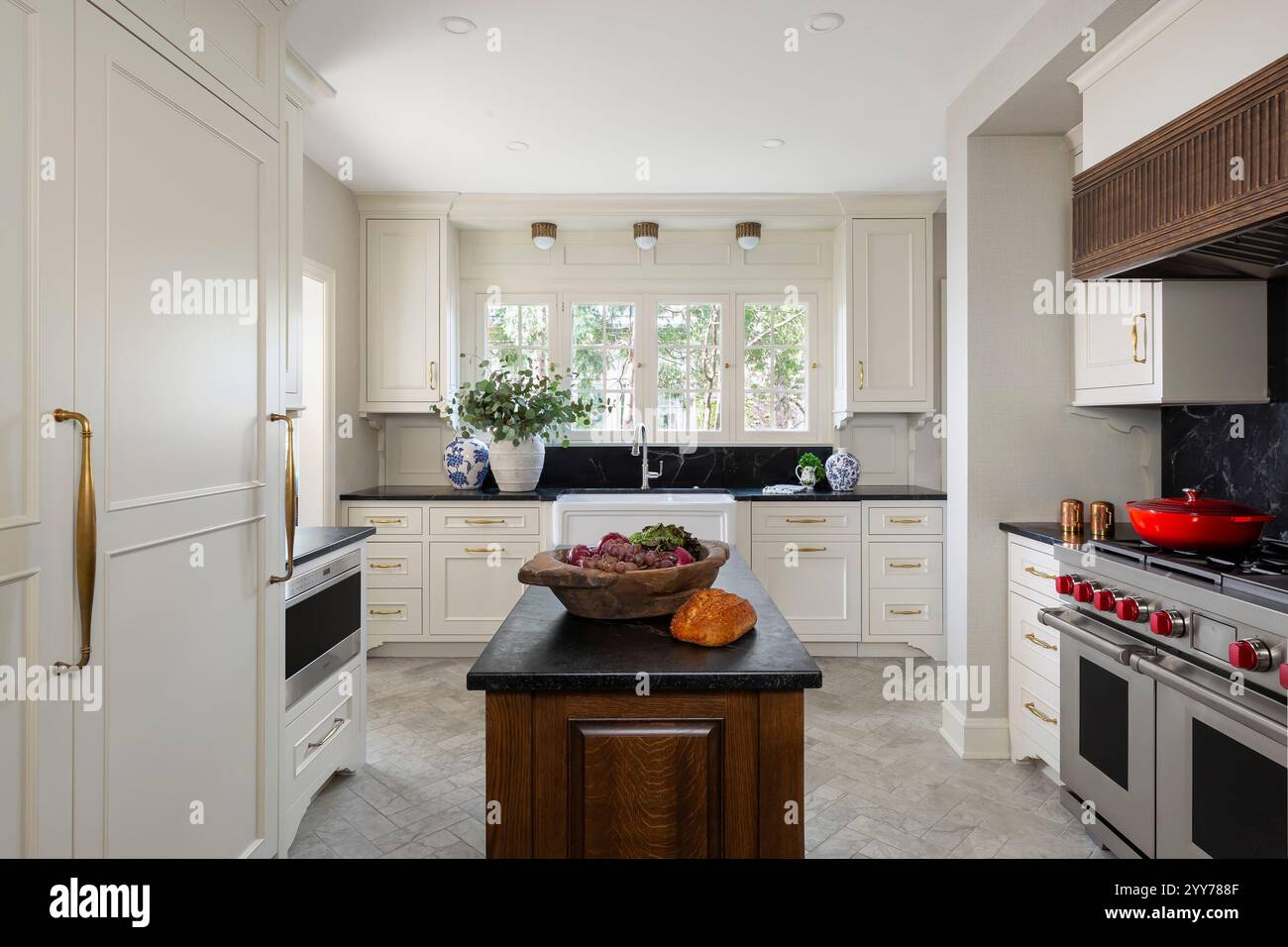 Traditional high end kitchen with small custom island and Wolf range ...