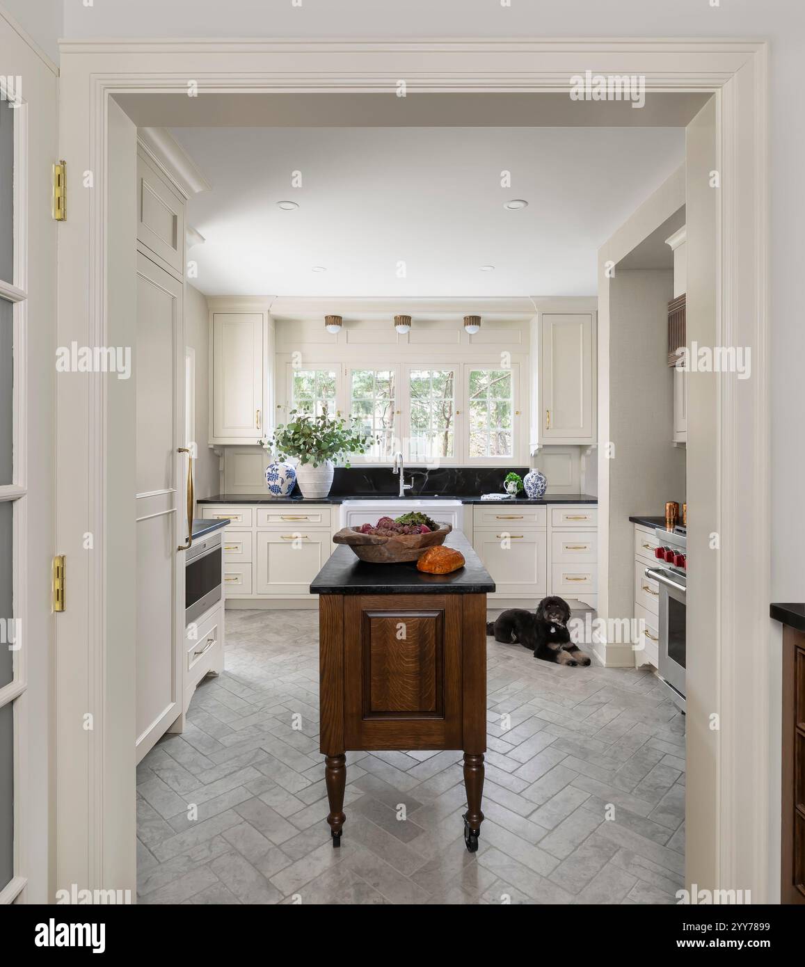 Looking through entryway into traditional high end kitchen with small ...