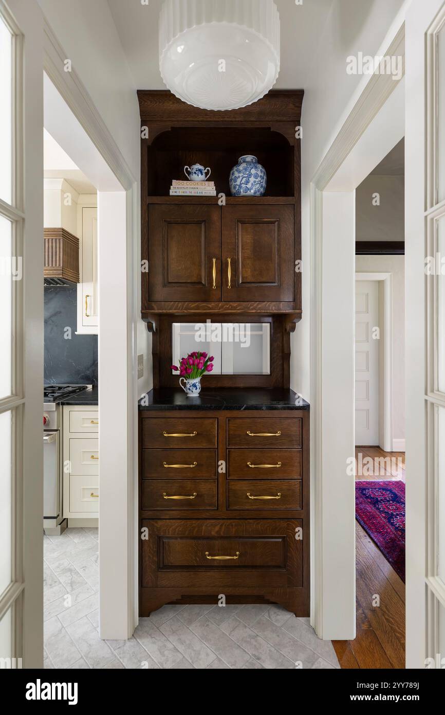 Built-in cabinet in small vestibule creates a kitchen drop zone Stock ...