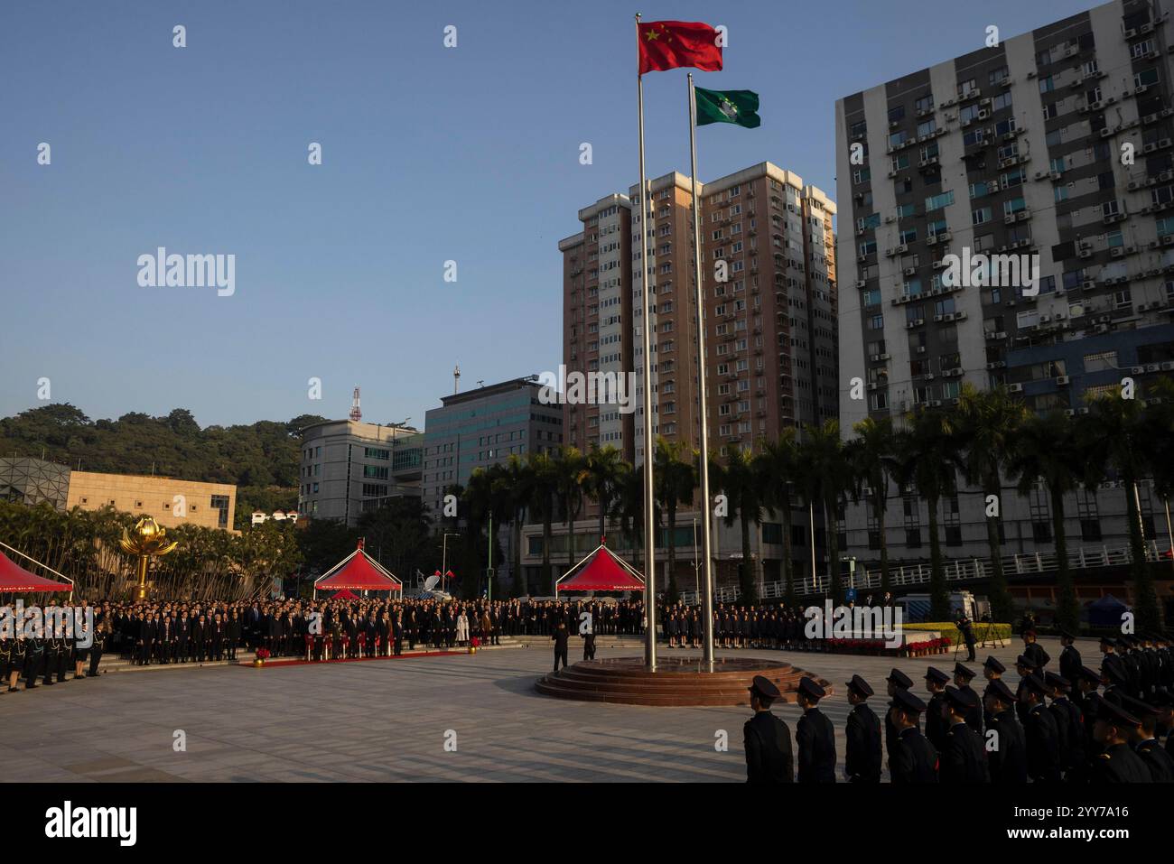 China and Macau flags fly over the Lotus square after a flag-raising ...
