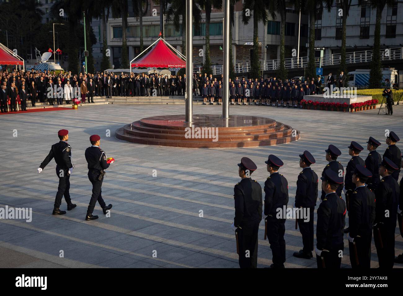 Security forces carry the Chinese and Macau flags before a flag-raising ...