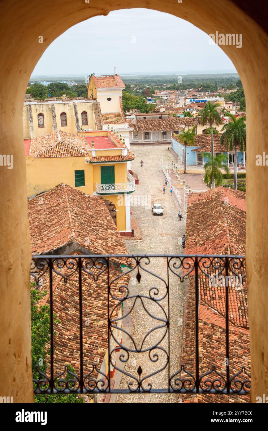 The Historical colonial buildings framed by a window of the bell tower ...