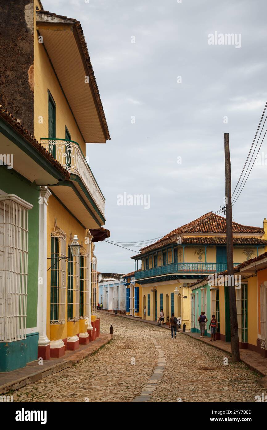 A Typical cobbletsone street and the colonial buildings in Trinidad ...