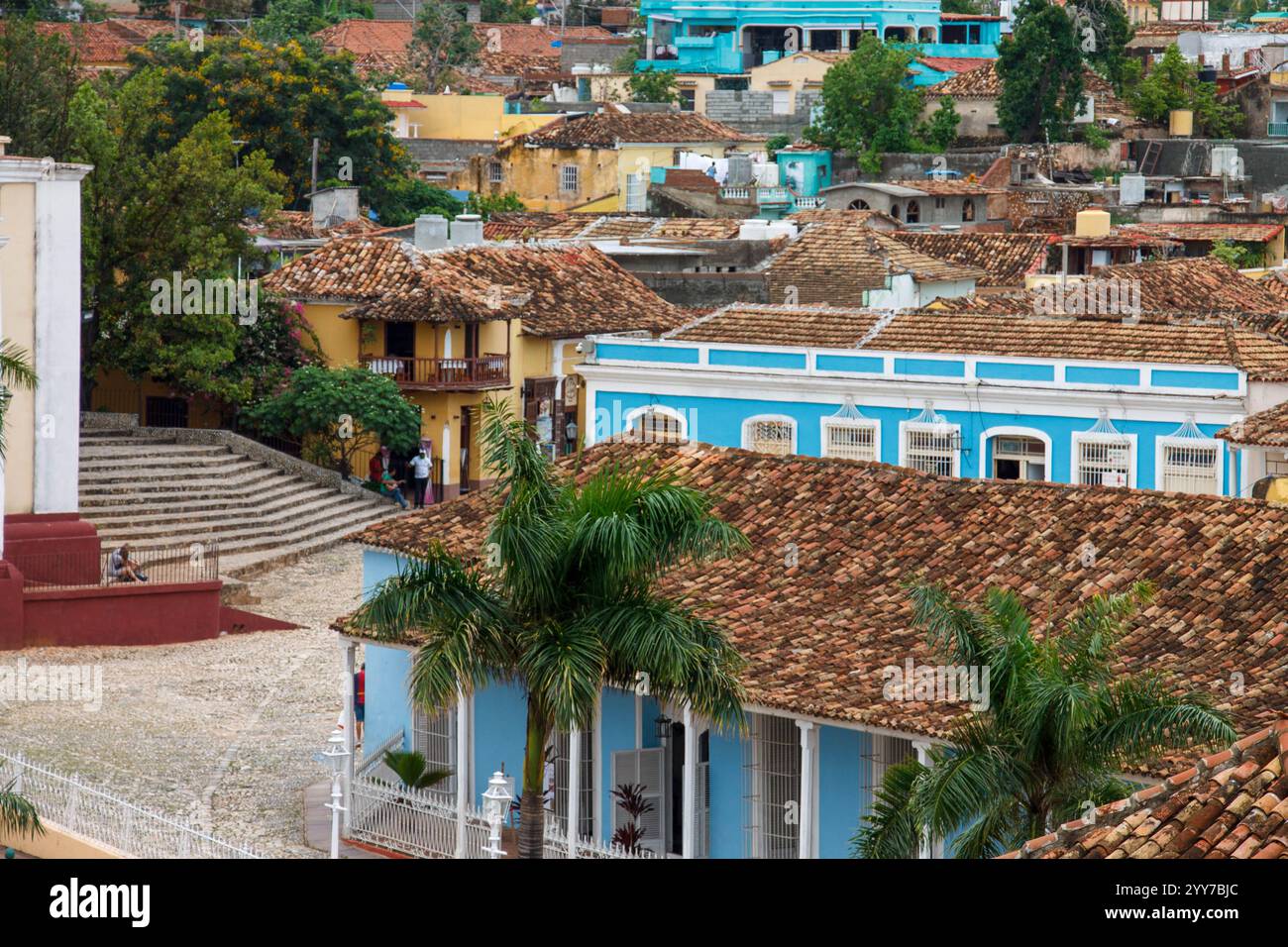 A Typical cobbletsone street and the colonial buildings in Trinidad ...