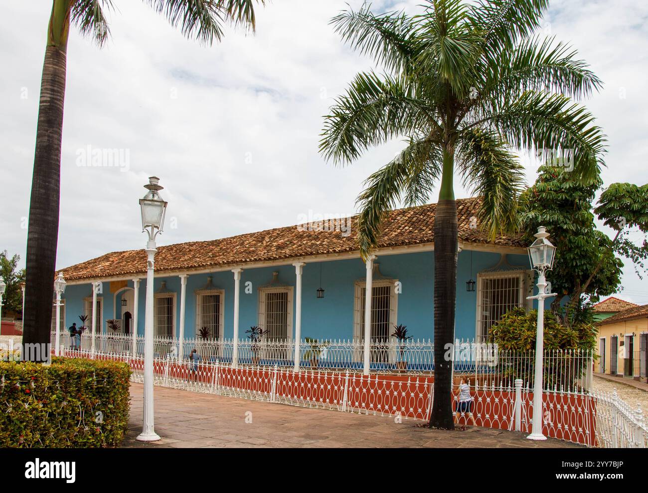 A Typical cobbletsone street and the colonial buildings in Trinidad ...