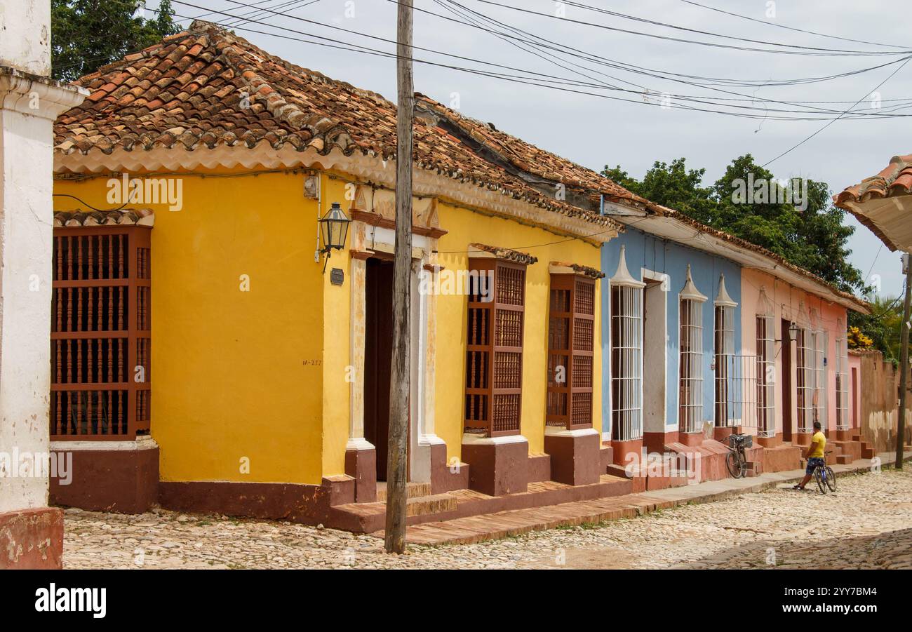 A Typical cobbletsone street and the colonial buildings in Trinidad ...